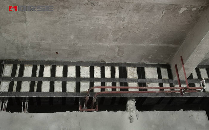 Slab crack strengthening by FRP wrap and crack injection adhesive